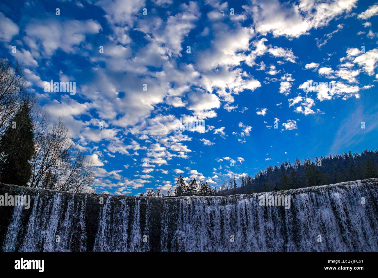 High water level on the Vistula River, water falling from the waterfall ...