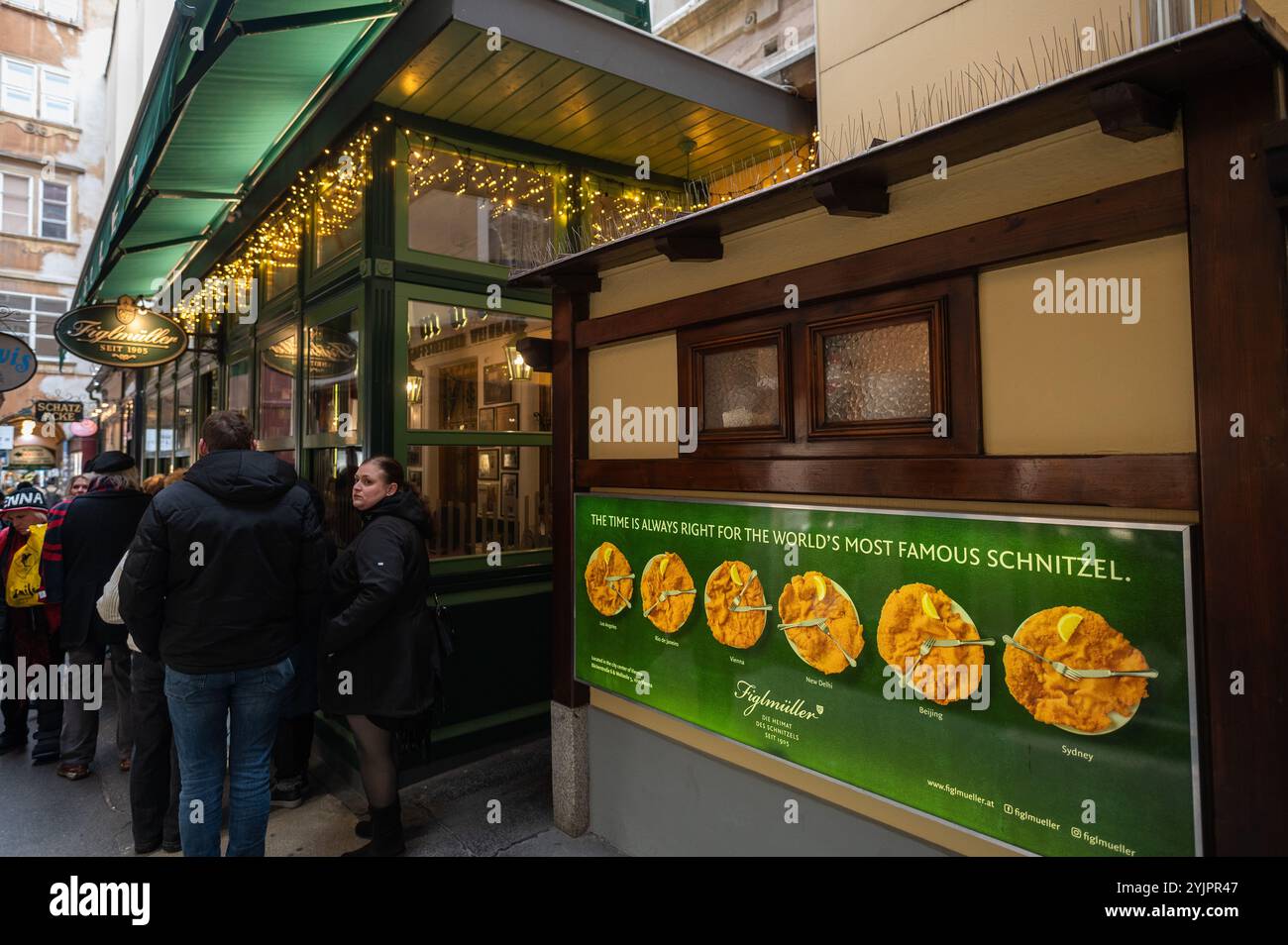 People queue to enter to the Figlmuller a restaurant famous for ...