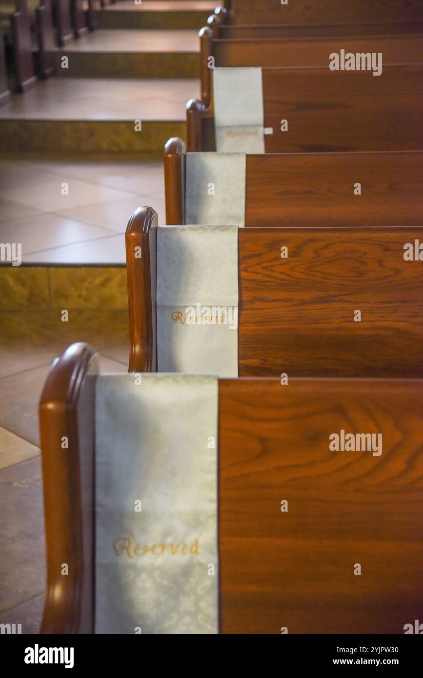 reserved sign on church pew Stock Photo - Alamy