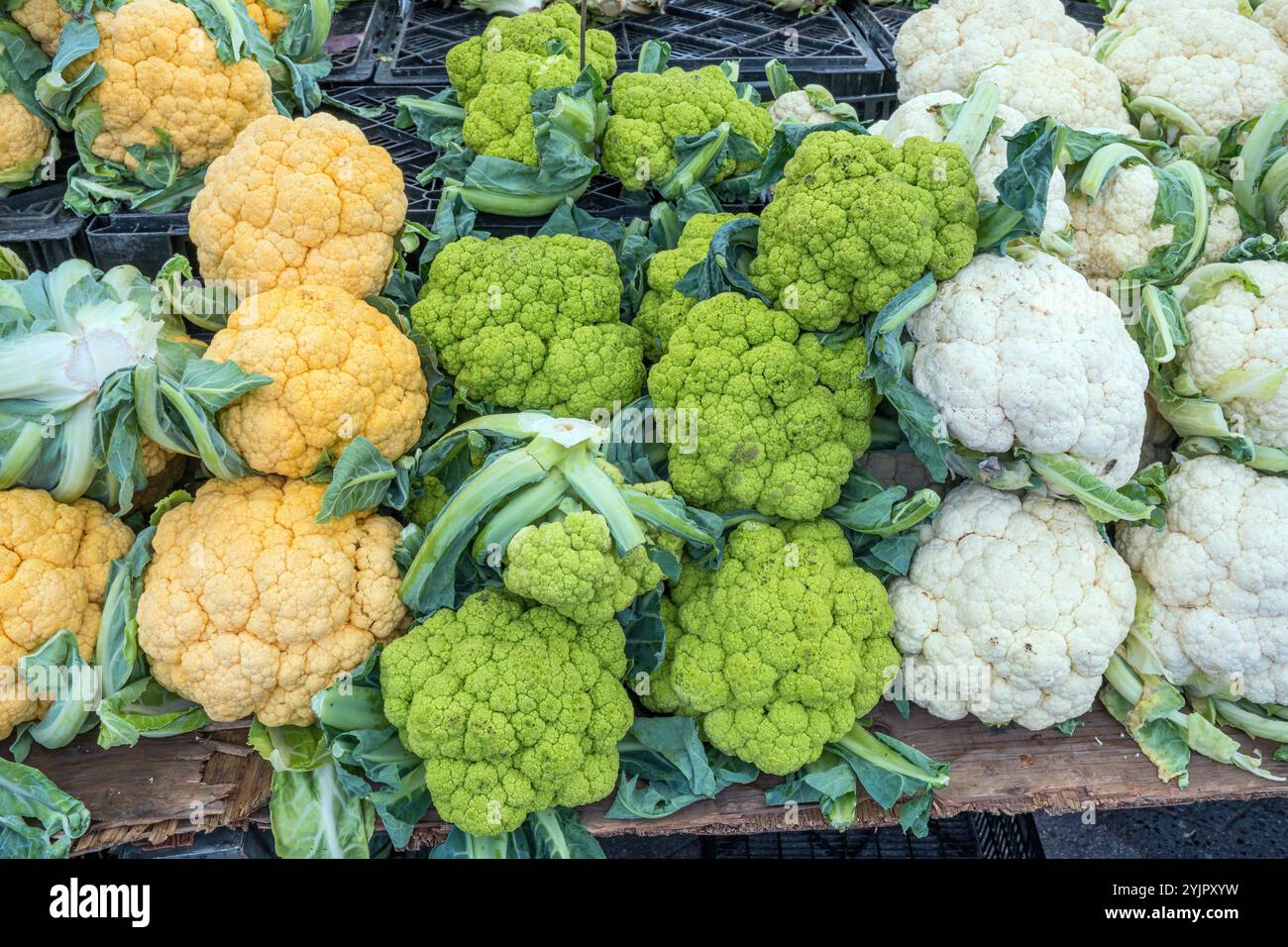 Cauliflower in various colors for sale at a market Stock Photo - Alamy