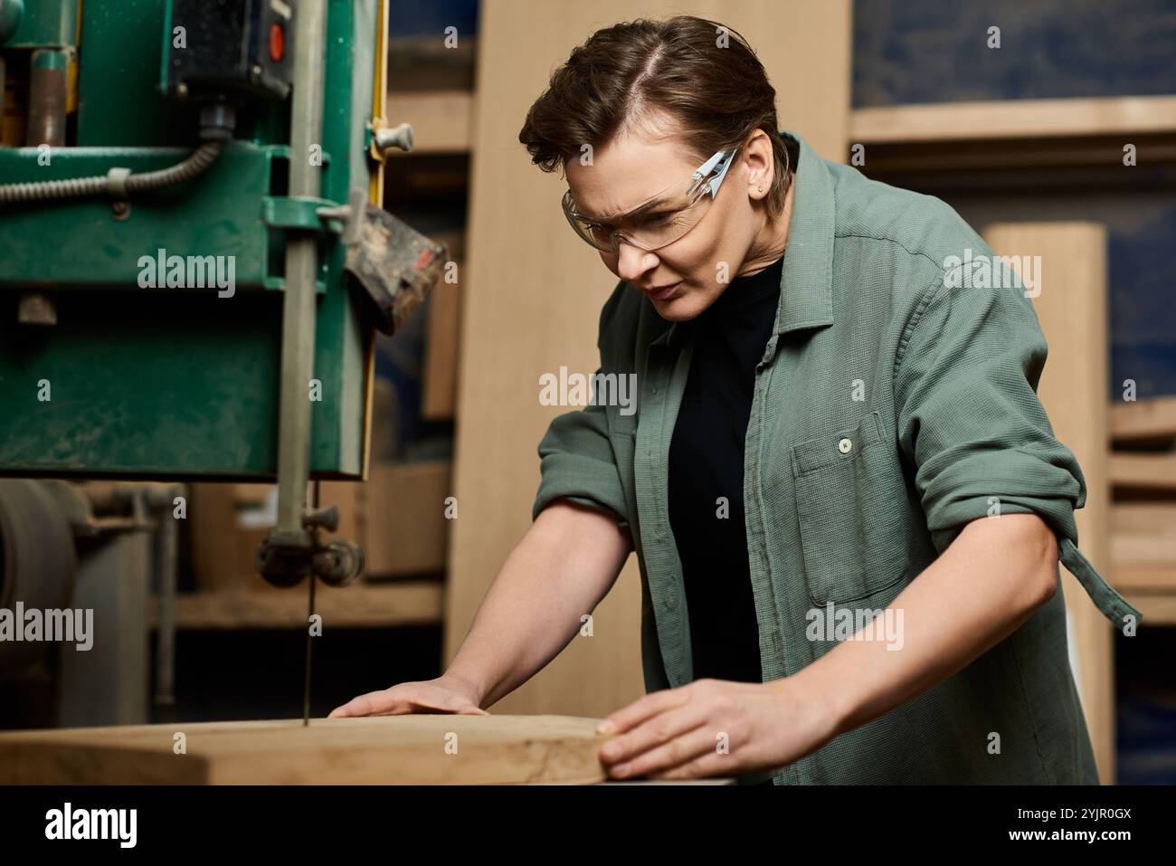 A dedicated carpenter meticulously works with wood in a well-equipped ...