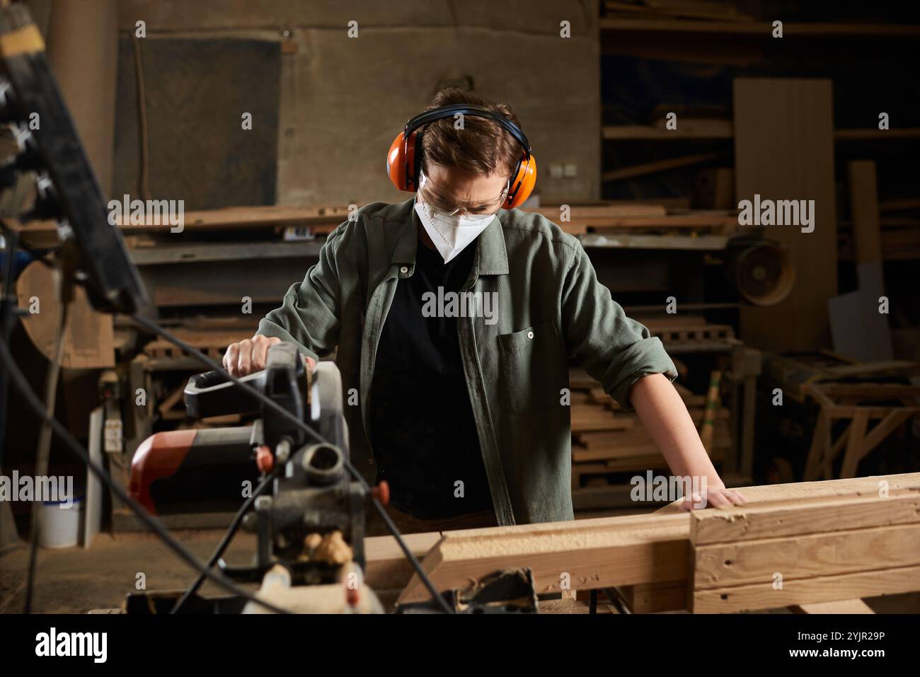 A skilled carpenter works diligently with wood, showcasing ...