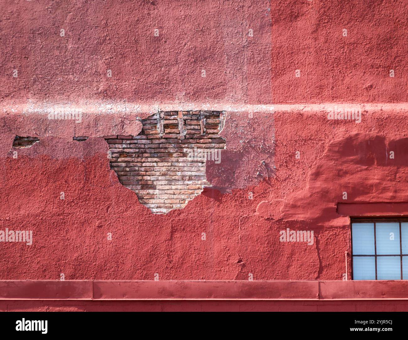 Building shedding stucco over brick Stock Photo - Alamy