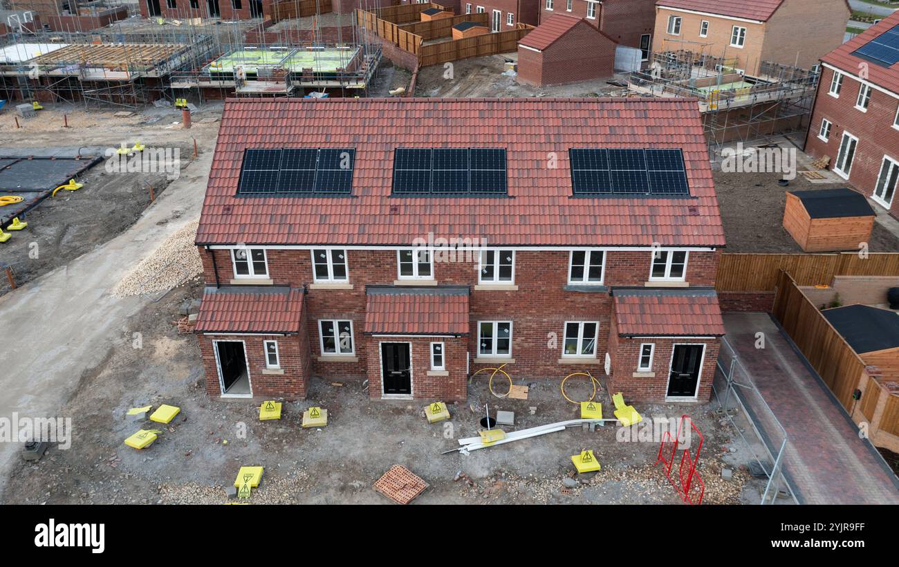 The roof of a row of new build houses on a construction site under ...