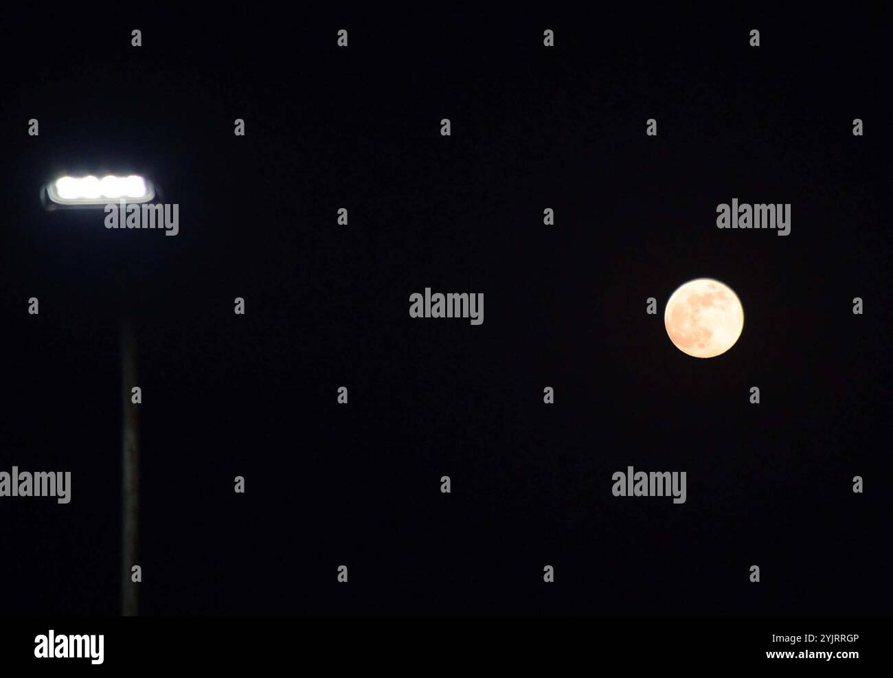 A beautiful eye-catching view of moon, captured over the horizon of ...