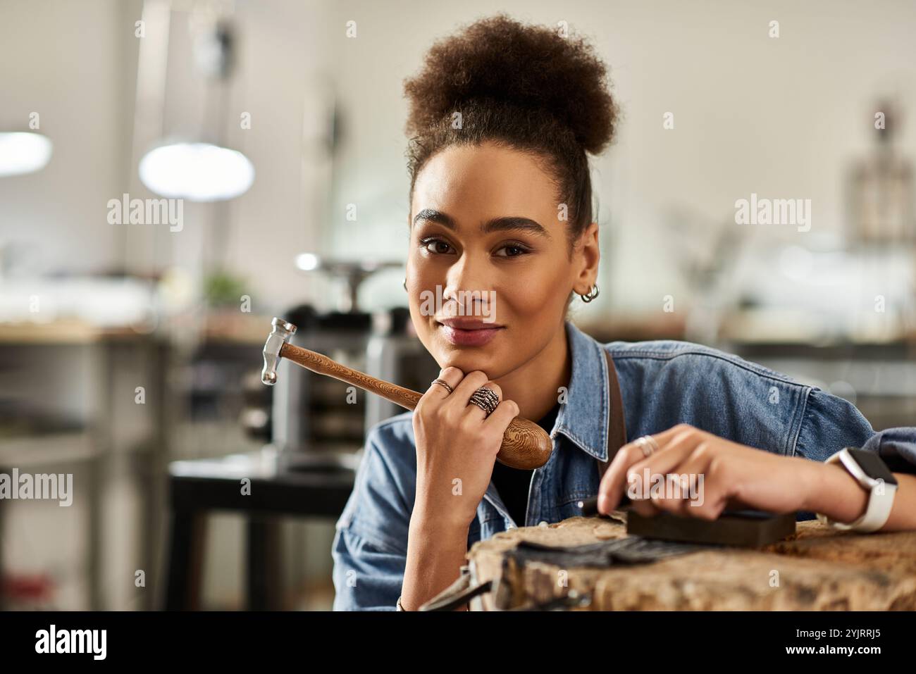 A talented woman focuses on her craft as she designs exquisite jewelry ...