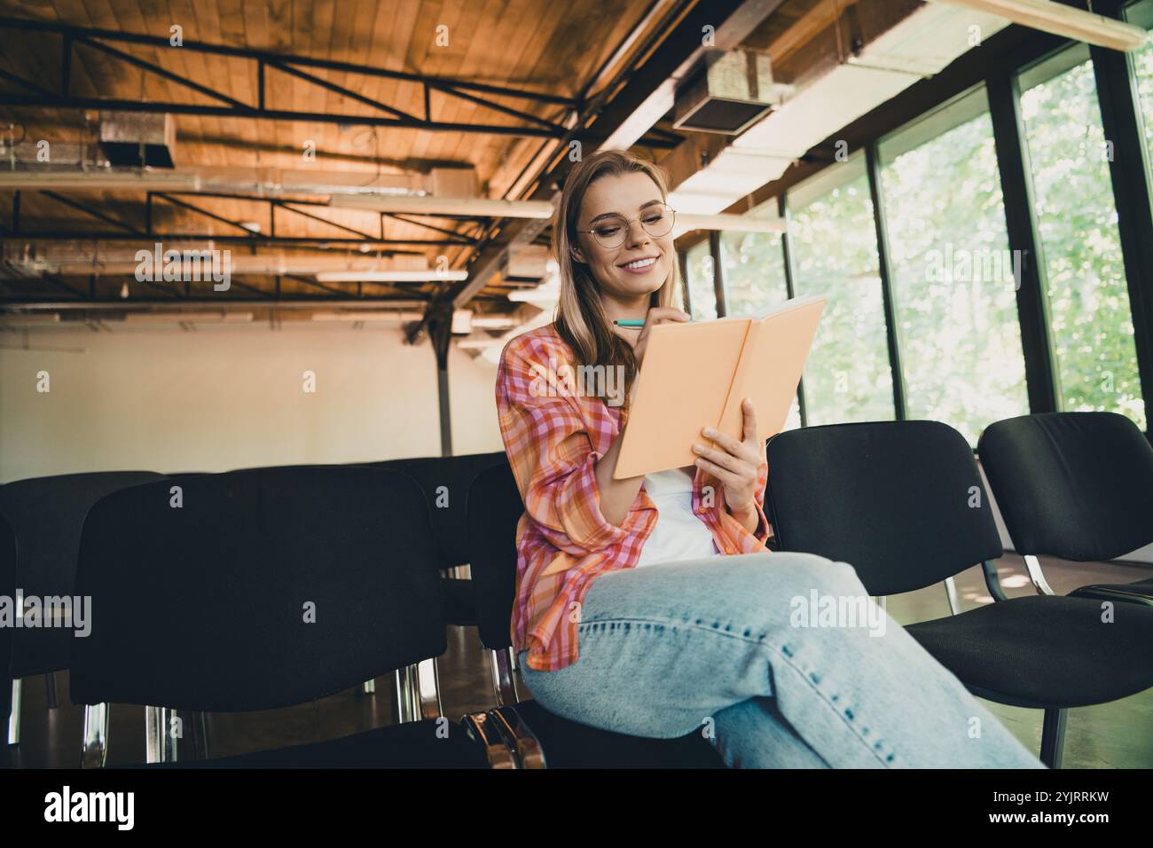 Photo of young blonde lady write notebook take notes dressed plaid ...