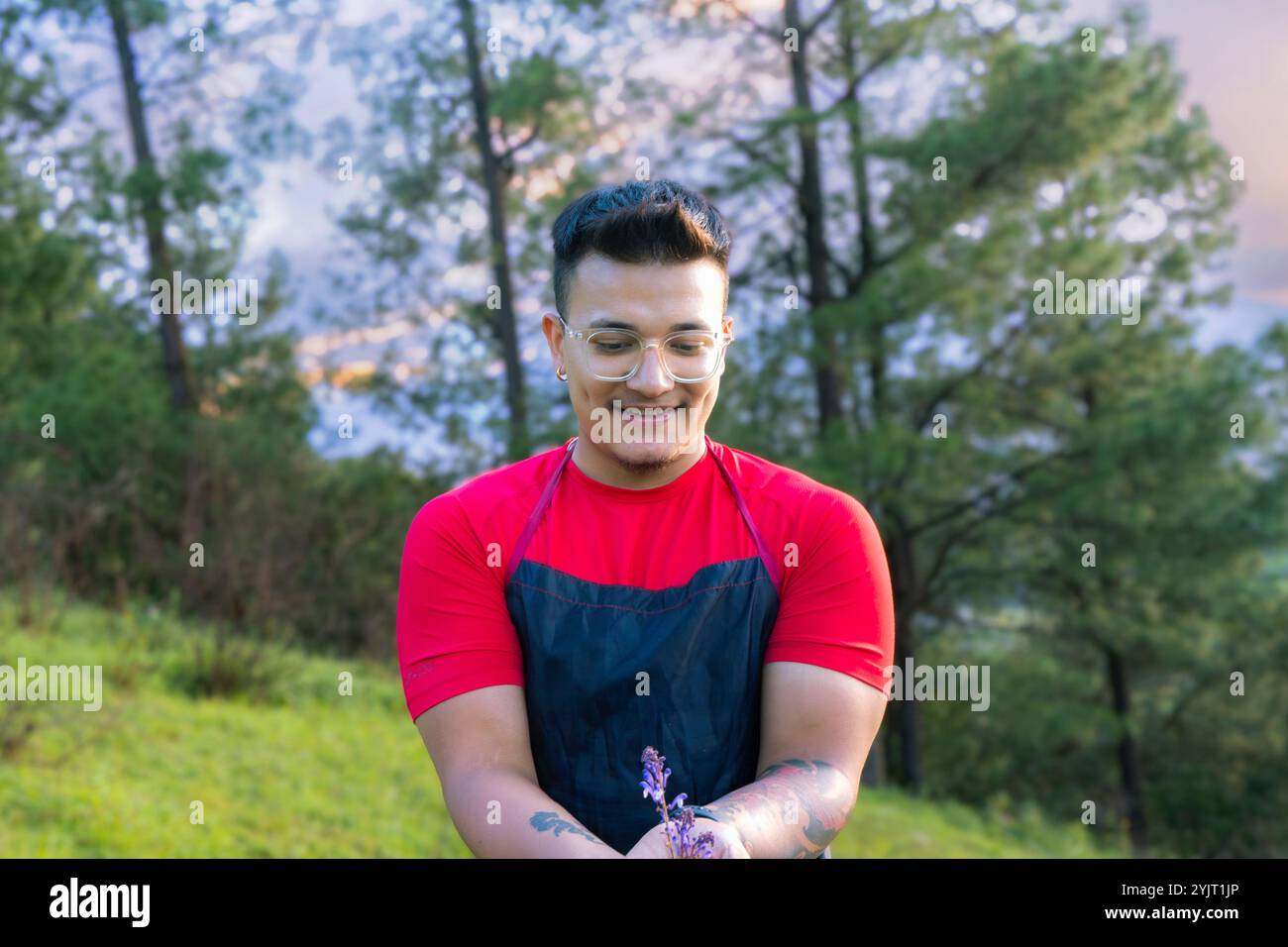 Young Garder in Nature Shows off Plants Stock Photo - Alamy