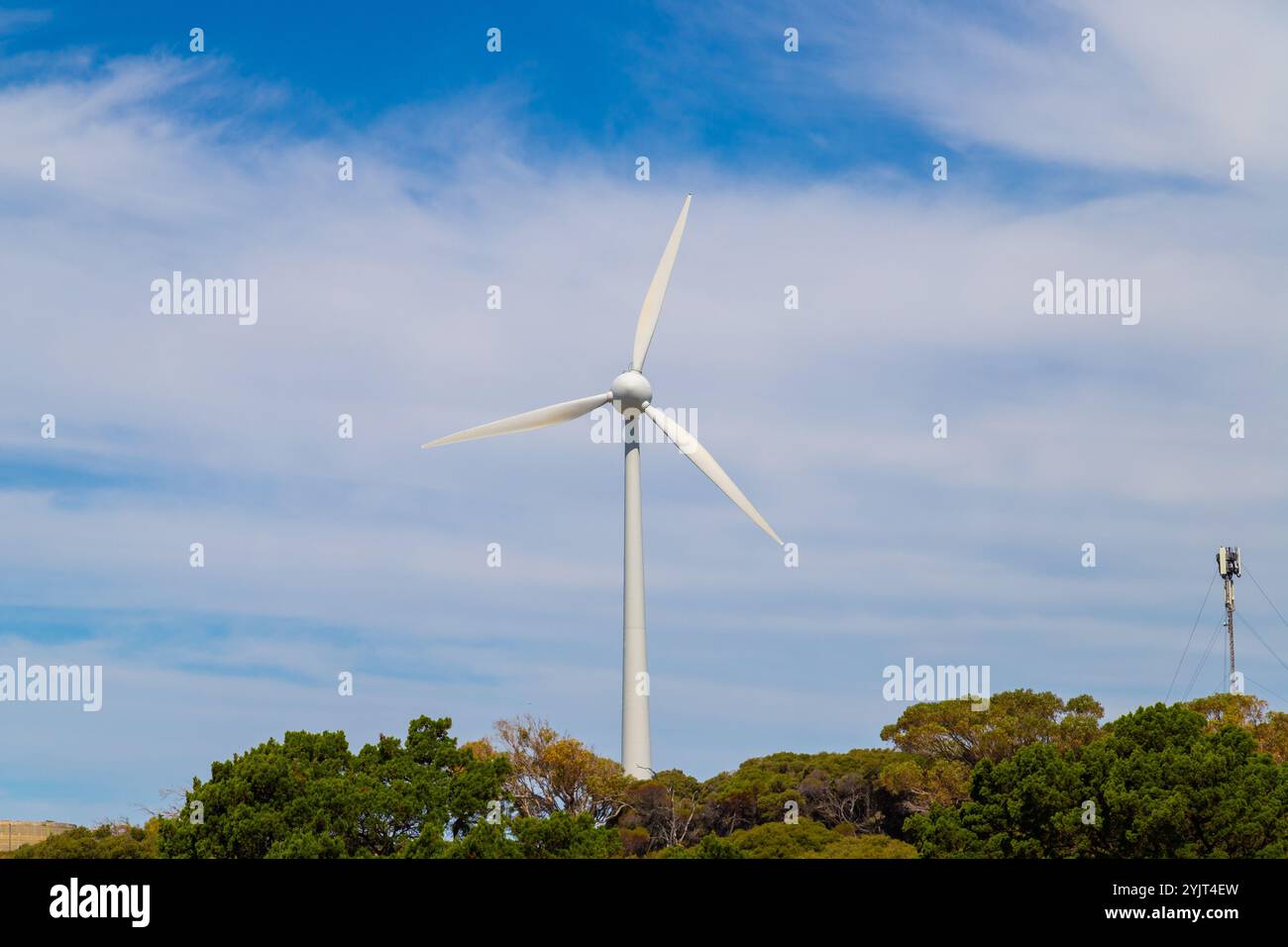 A closeup to a typical wind turbine outside in a rural setting with ...