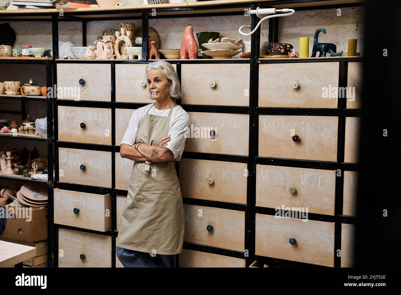 A skilled artisan reflects on her craft while surrounded by vibrant ...