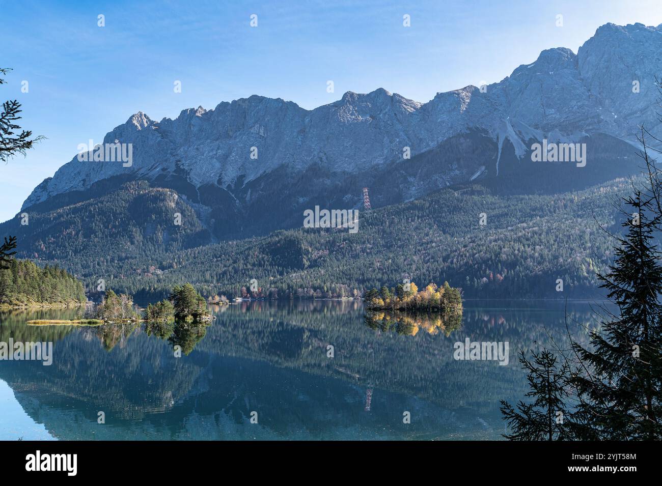 Autumn colors in fall at lake Eibsee. Alpine landscape with German Alps ...