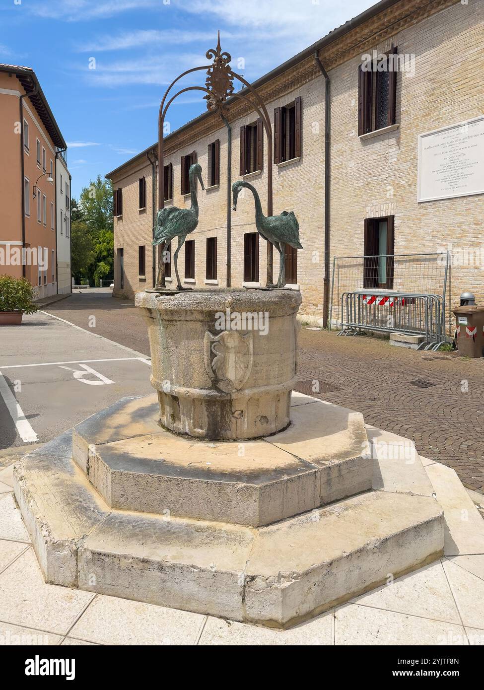 Portogruaor, Venice, Italy - June 26, 2024: Crane well, bronze statues ...