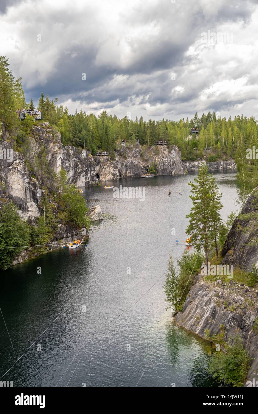Visitors admire the tranquil waters and rugged cliffs of Marble Canyon ...