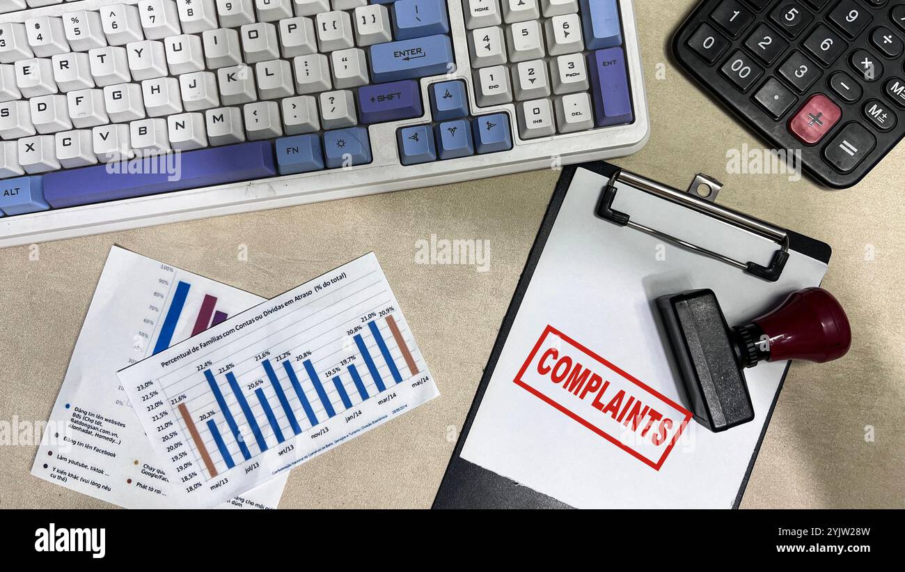 Red Handle Rubber Stamper and Complaints text on a paperwork isolated ...