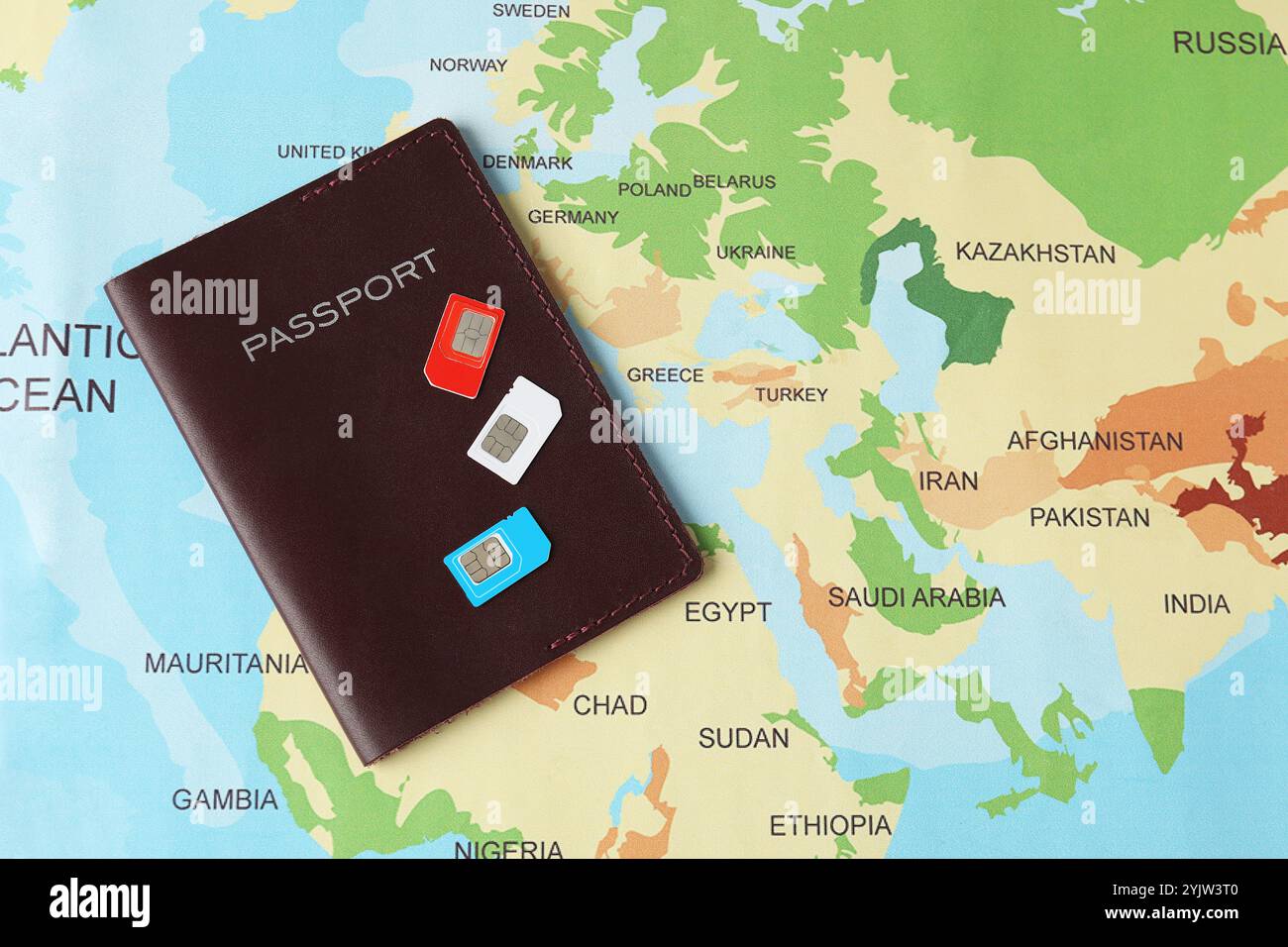 SIM cards and passport on world map, flat lay Stock Photo - Alamy