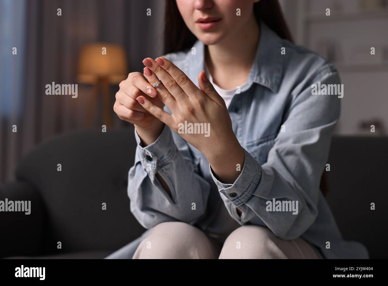 Woman taking off ring hi-res stock photography and images - Alamy