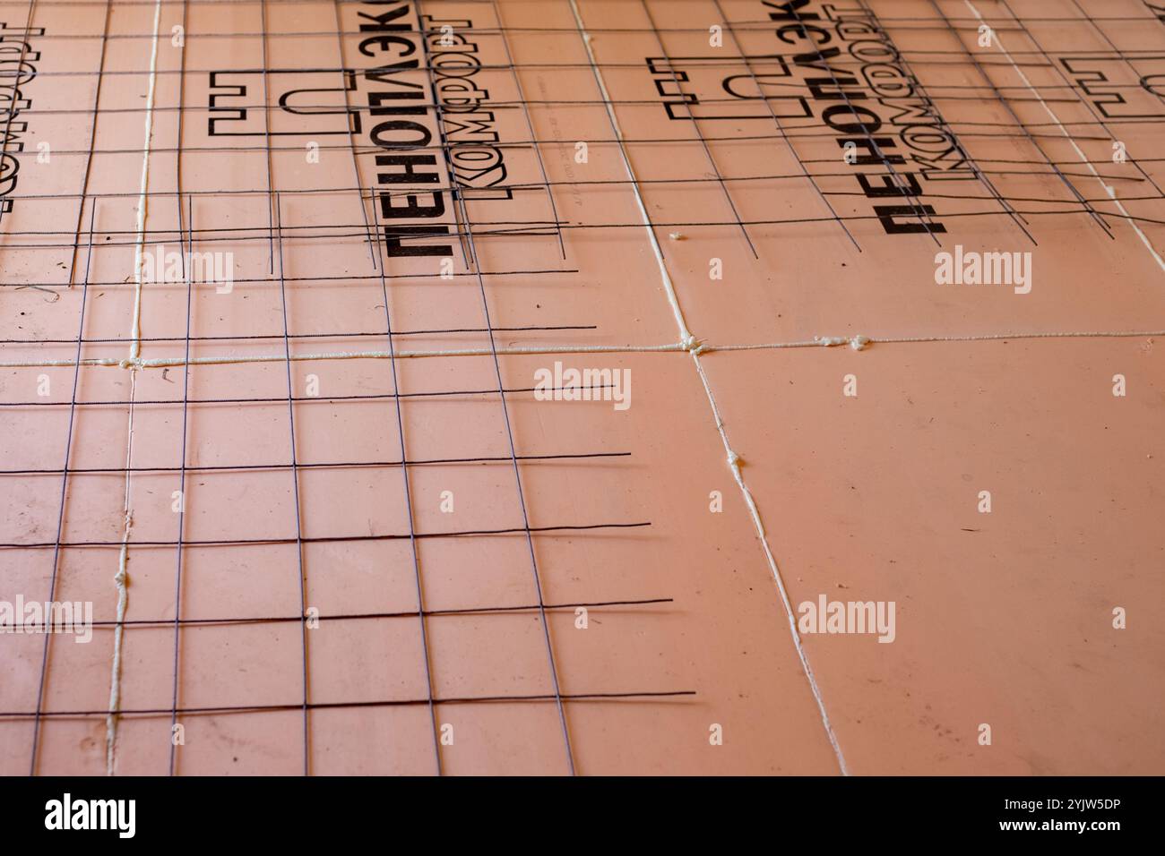 Installation of underfloor heating. The welded reinforcement mesh lies ...