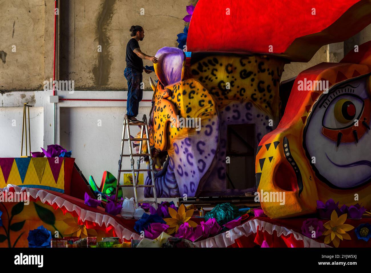 A Colombian artisan attaches the completed elements to the top of the ...