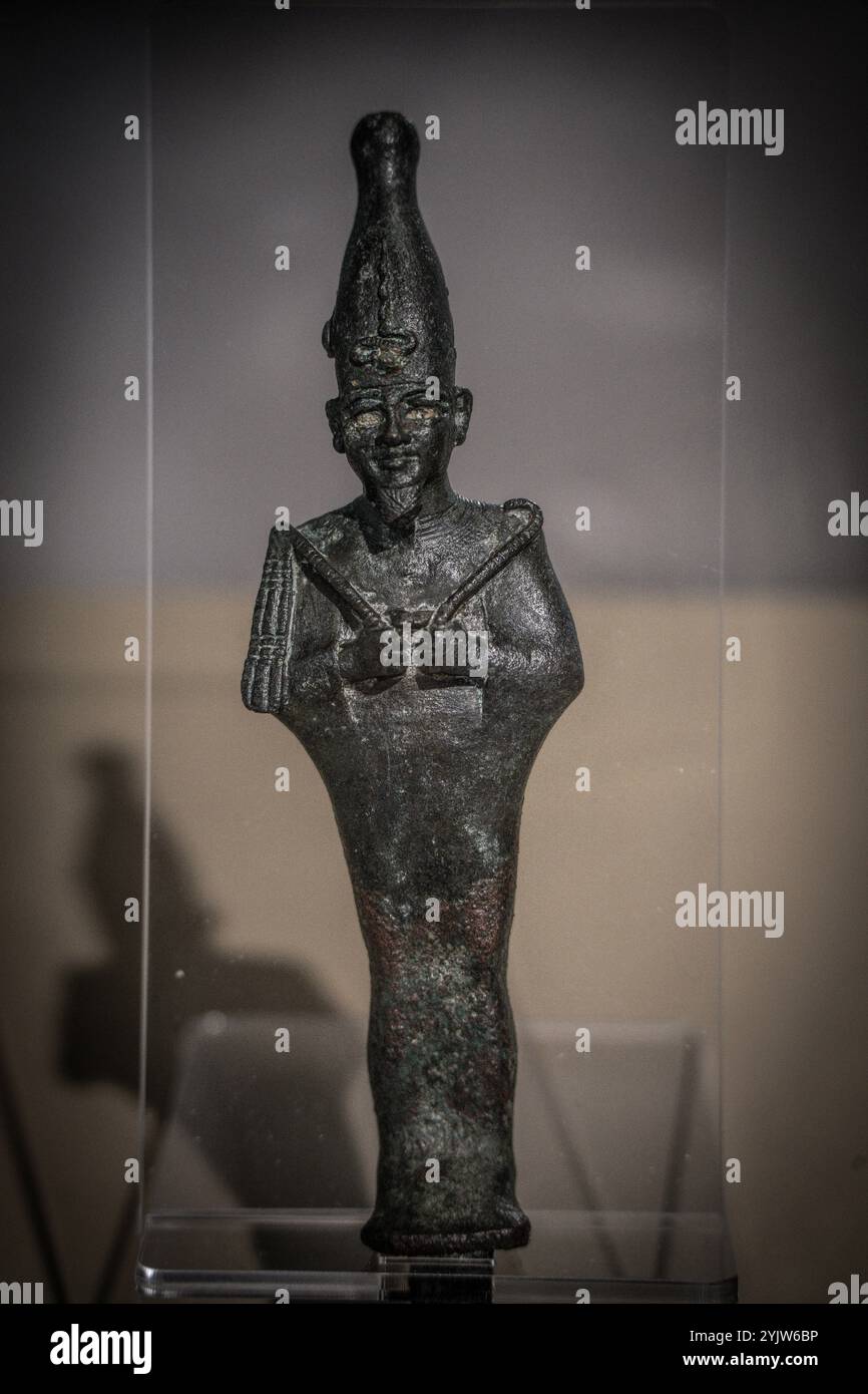 The mummified god Osiris wearing the atef crown, uraeus, the scepter ...