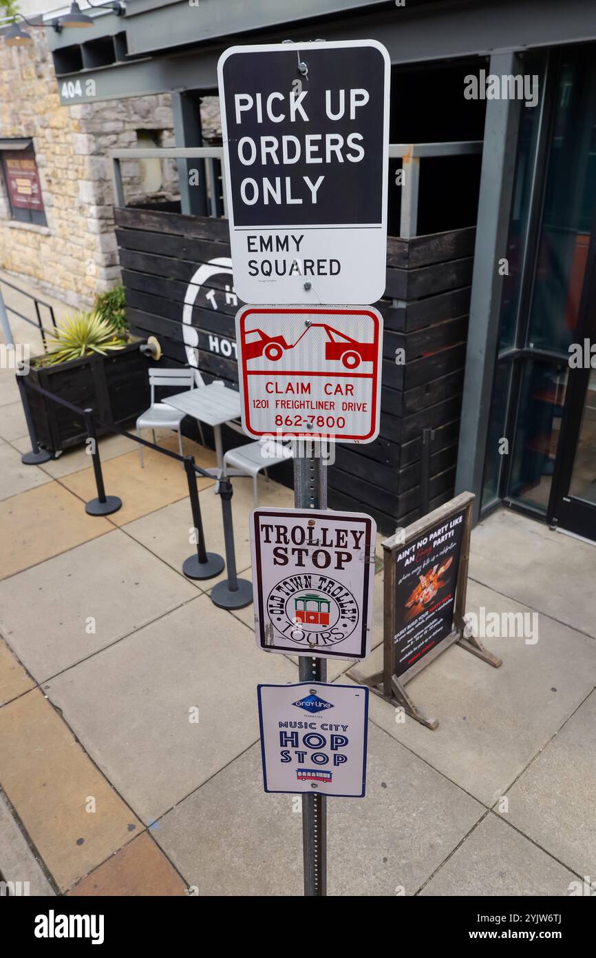 NASHVILLE, TN - 15 MAR 2024: Signs on the sidewalk in front of Emmy ...