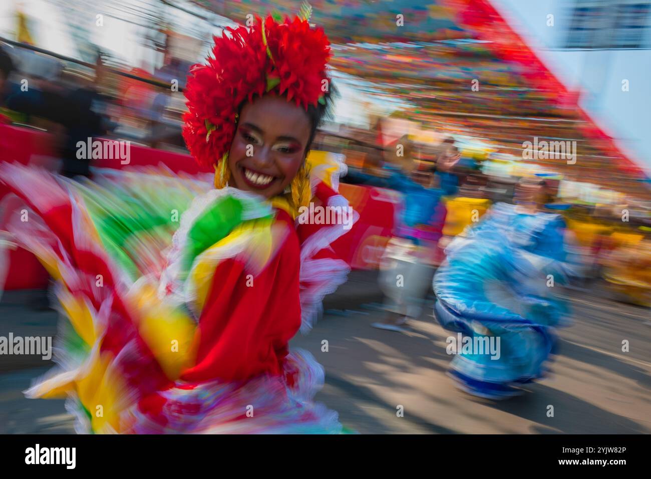 An Afro-Colombian woman, twirling a traditional cumbia skirt, dances ...