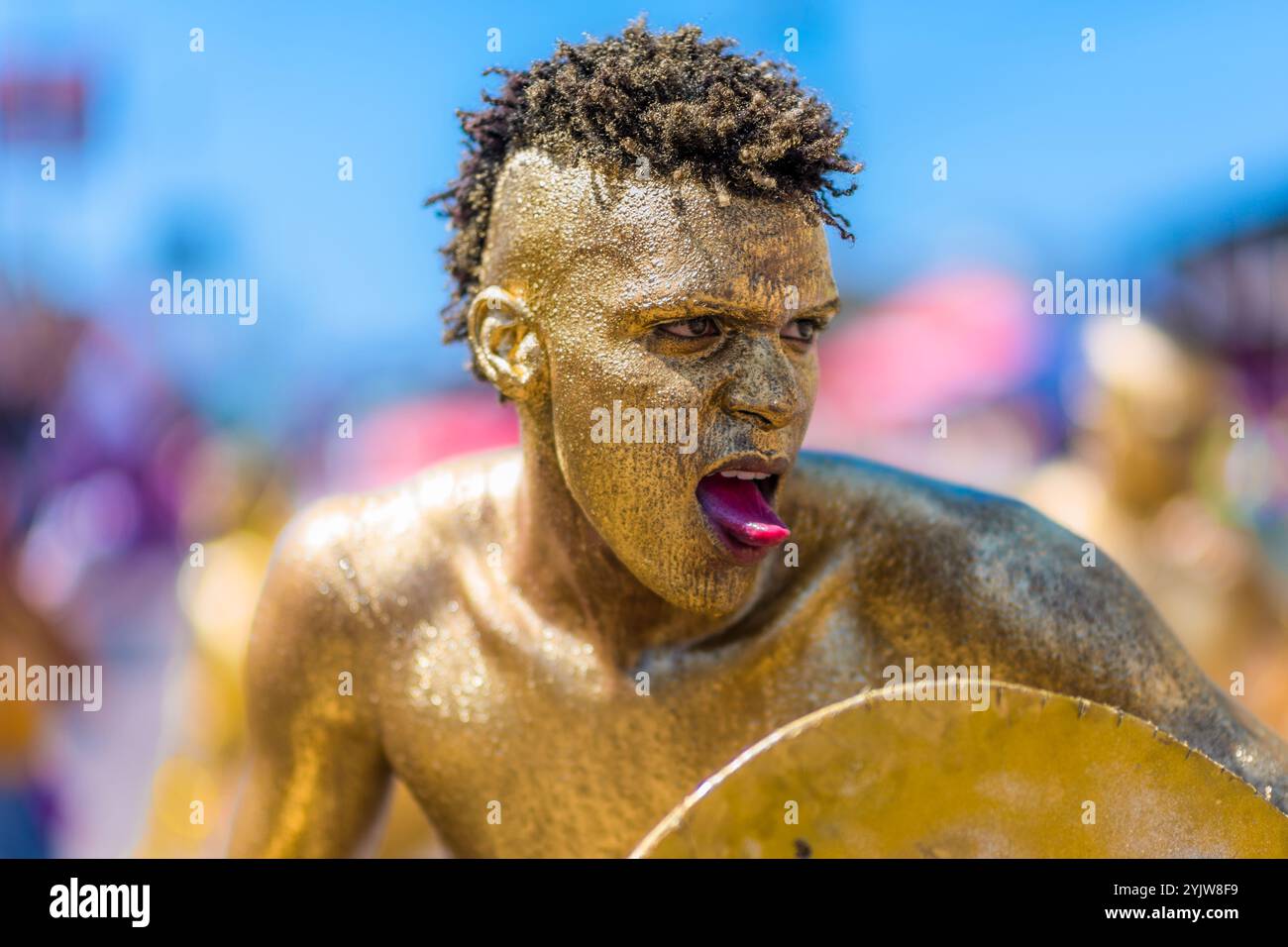 A Colombian man, painted in gold and representing the original ...