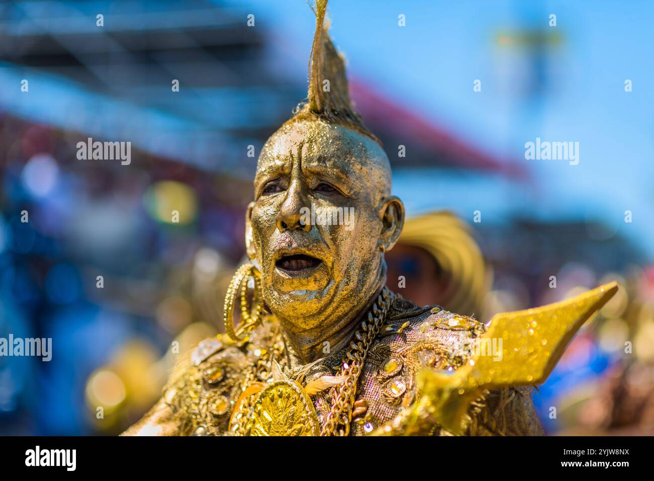 A Colombian man, painted in gold and representing the original ...