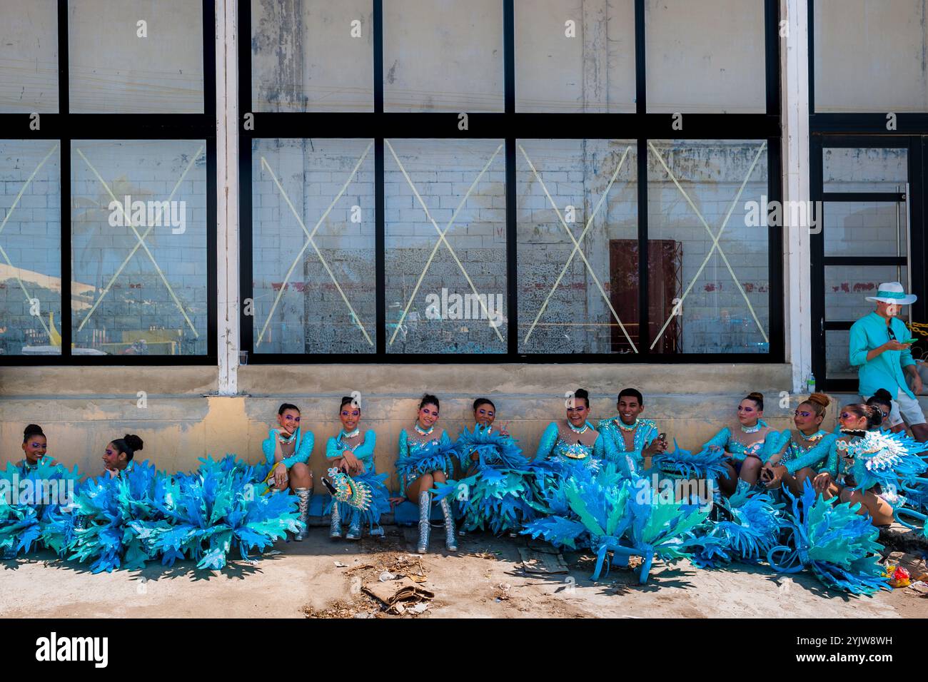 Colombian dancers wait for the start of the Batalla de Flores, the ...