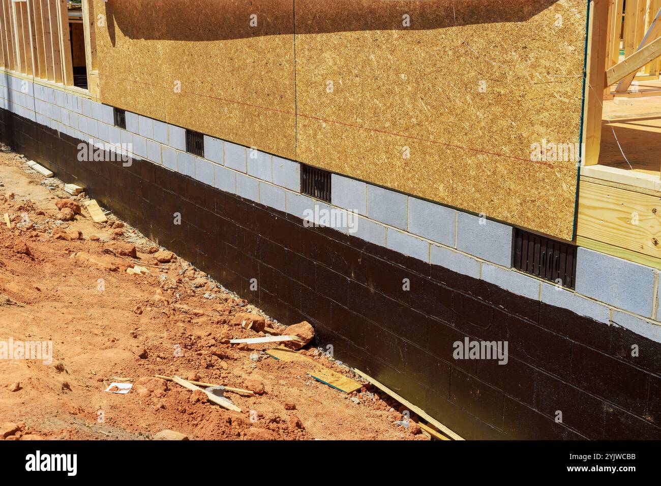 Foundation of new home is being constructed, revealing completed black ...