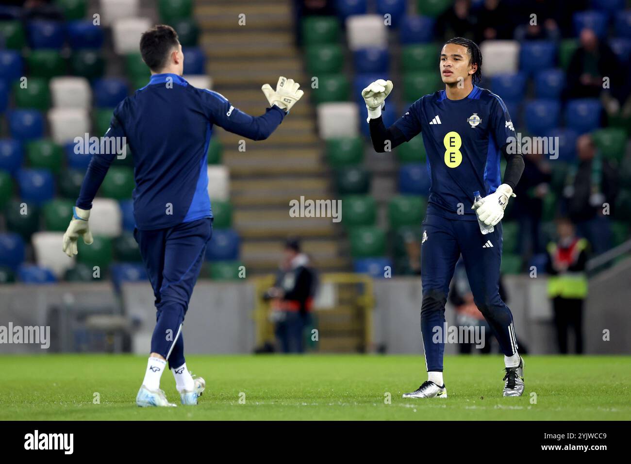 Northern Ireland’s goalkeeper Pierce Charles (right) and teammate ...