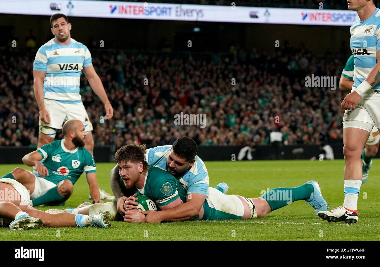 Ireland's Joe McCarthy scores their side's third try of the game during ...