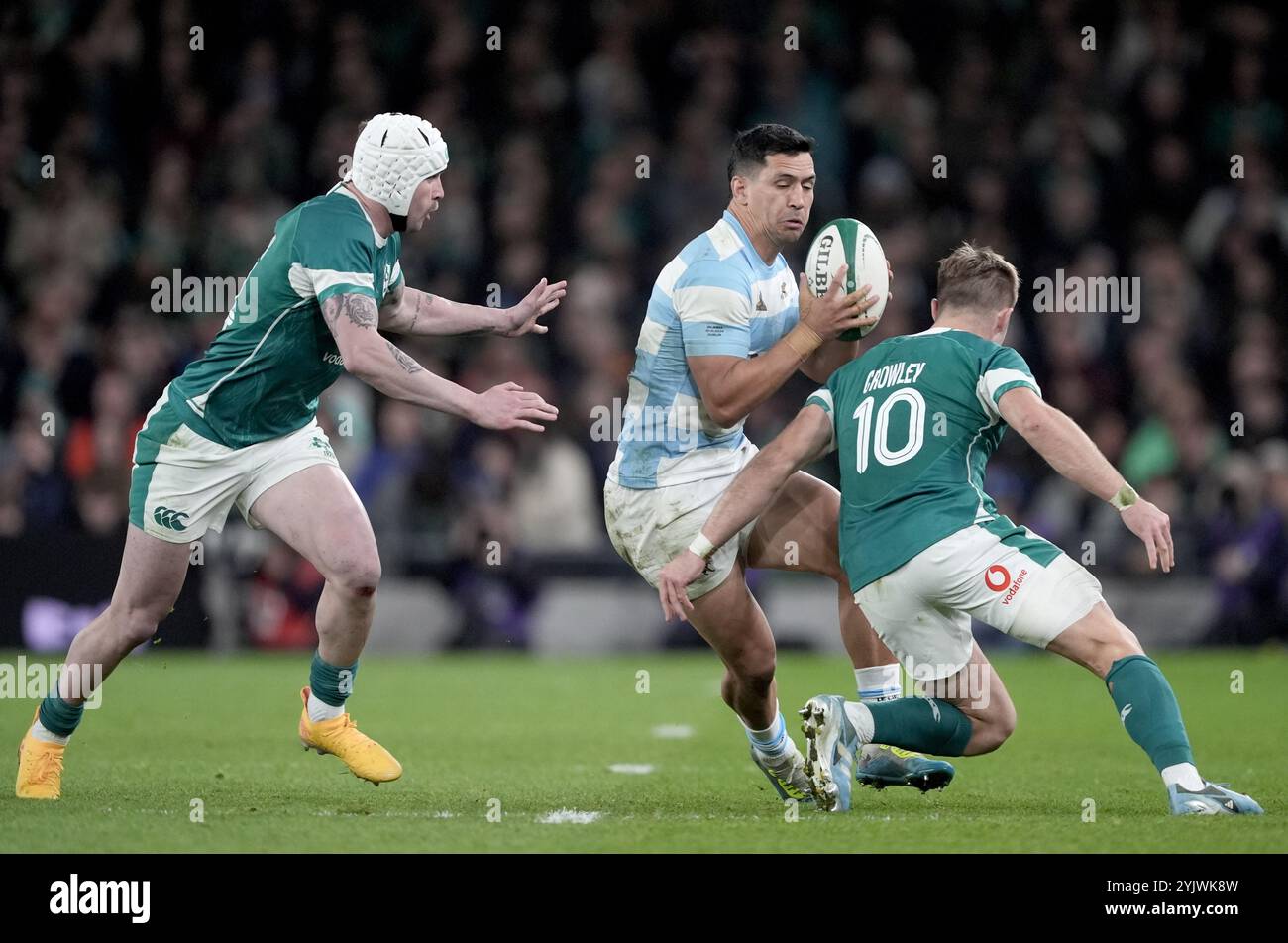 Argentina's Matias Moroni (centre) is tackled by Ireland's Jack Crowley ...