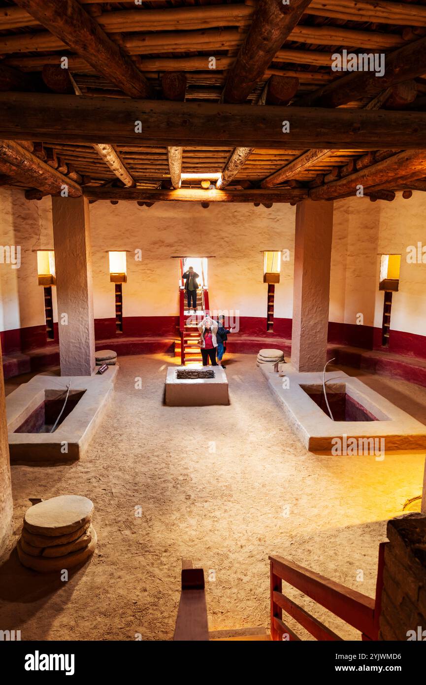 Tourists visit interior of Great Kiva; Aztec West; Aztek Ruins National ...