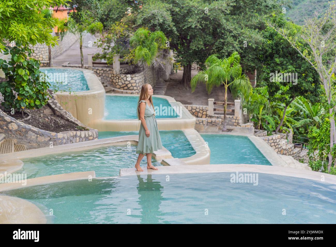 Female tourist at the hot springs of Grutas Tolantongo, Mexico ...