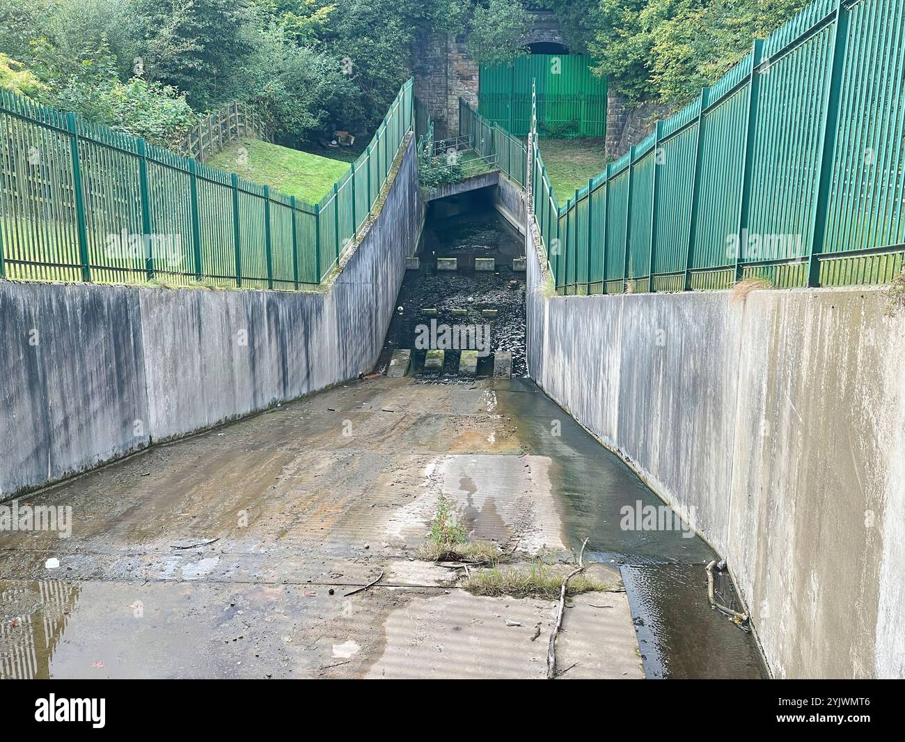 Manchester, UK, Oct 4 2024. The spillway from Gorton lower reservoir ...