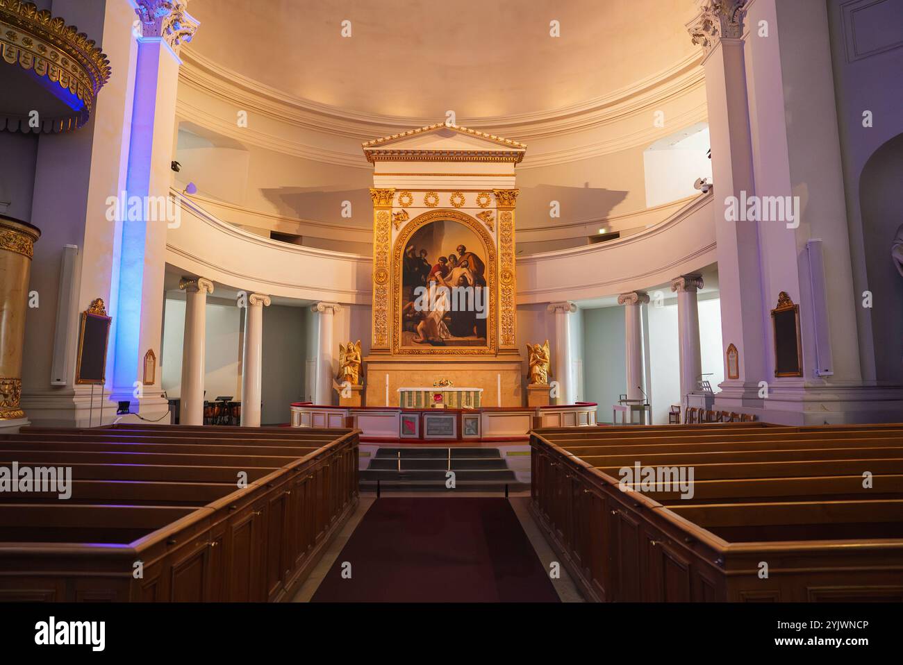 The neoclassical altar area of Helsinki Cathedral features an ornate ...