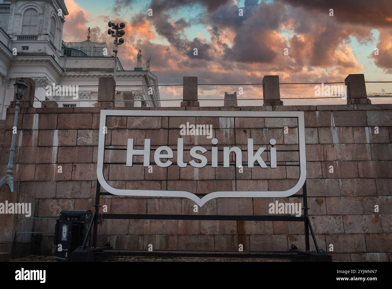 Helsinki Sign with Neoclassical Building and Dramatic Sky Stock Photo ...