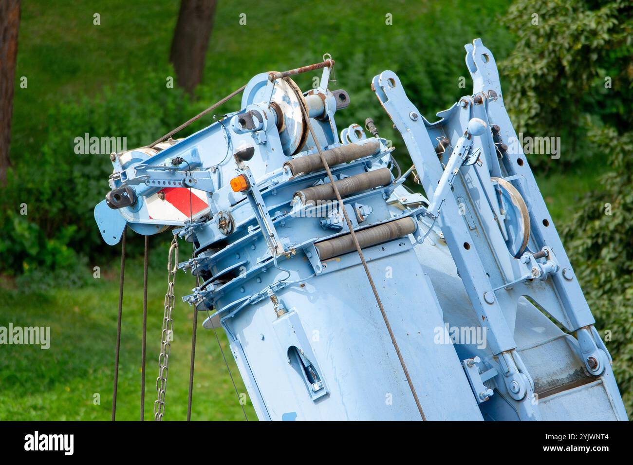 Detail of blue crane main boom tip with load line Stock Photo - Alamy