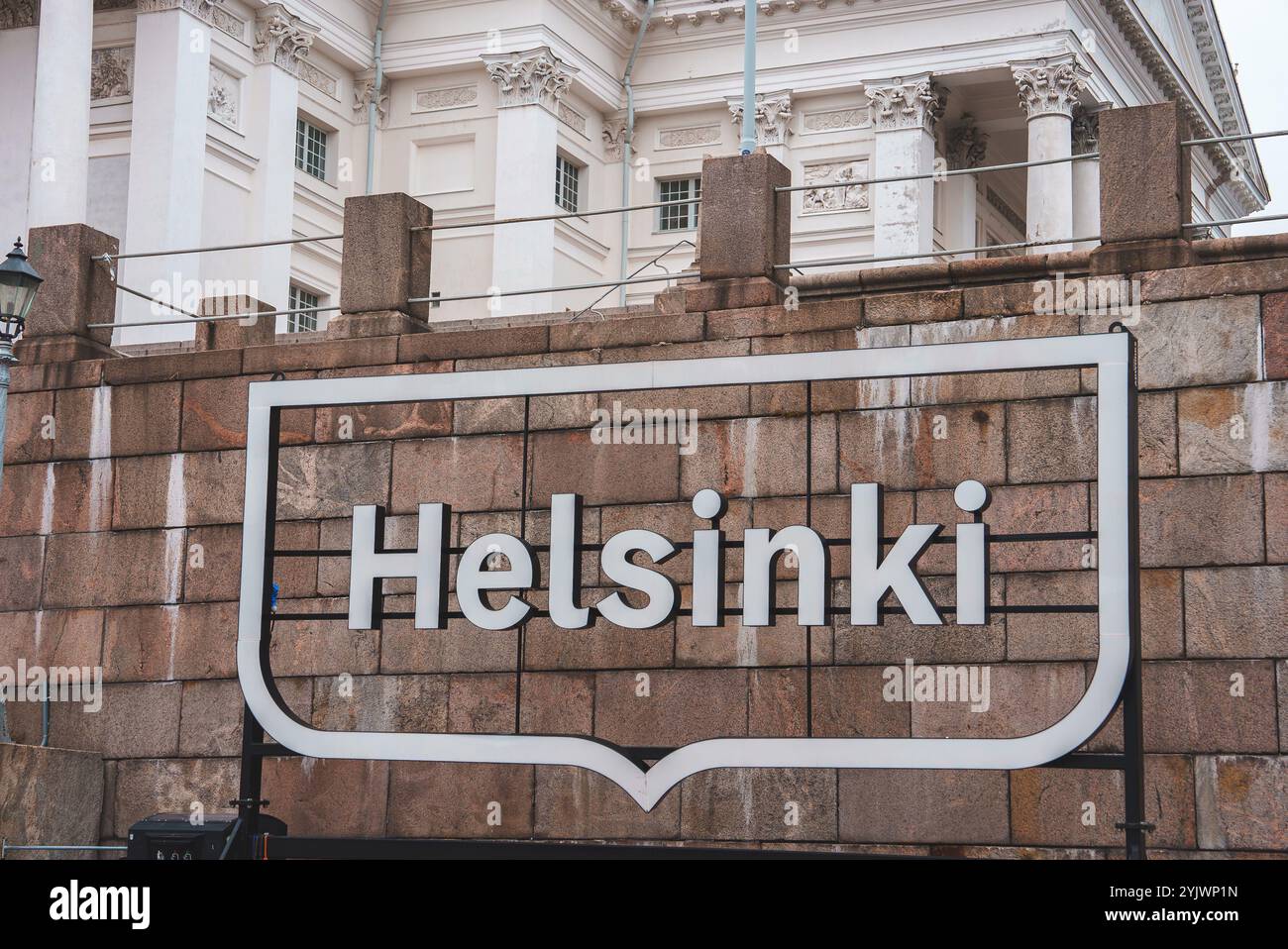Helsinki Sign in Front of Historic Building with Classical Architecture ...