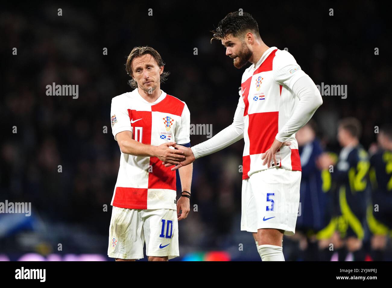 Croatia's Luka Modric (left) and Duje Caleta-Car react after the final ...
