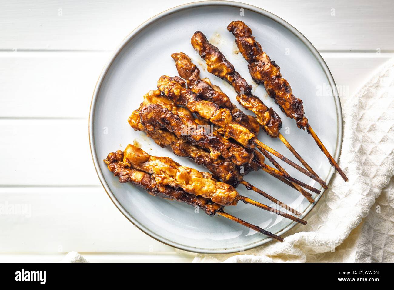 Japanese chicken yakitori on plate on a white table. Top view Stock ...
