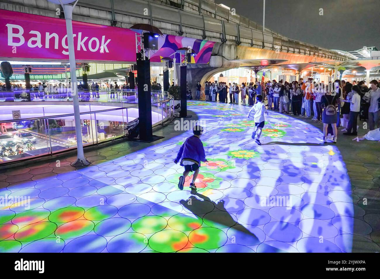 Bangkok, Thailand. 15th Nov, 2024. Children run on the eco-friendly ...