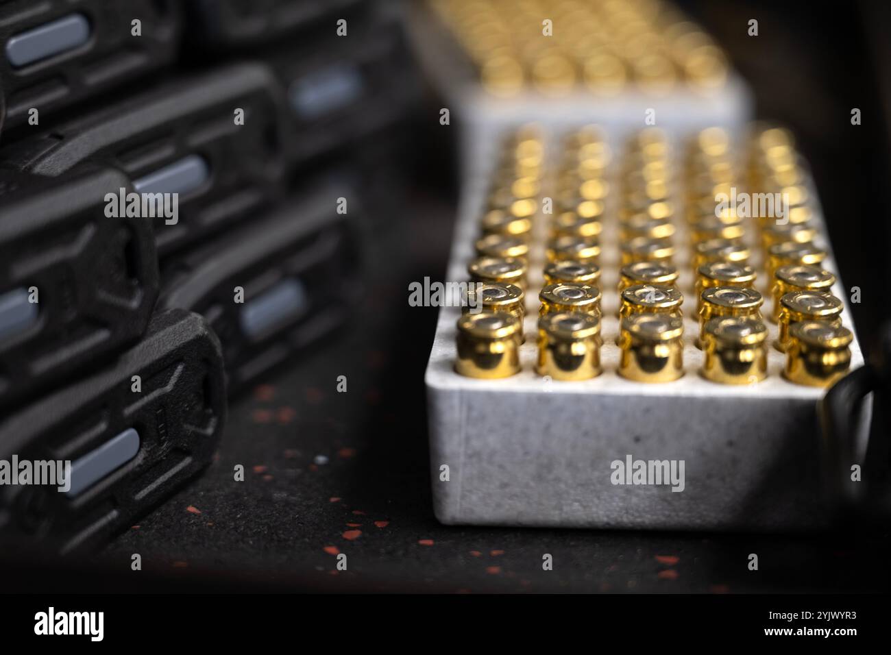 M4A1 carbine magazines and ammunition are on a table prior to an annual ...