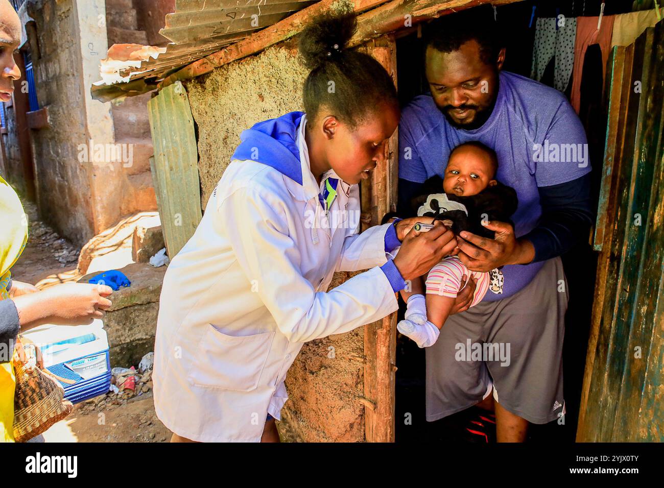 A community health worker seen marking a childs finger after an oral ...