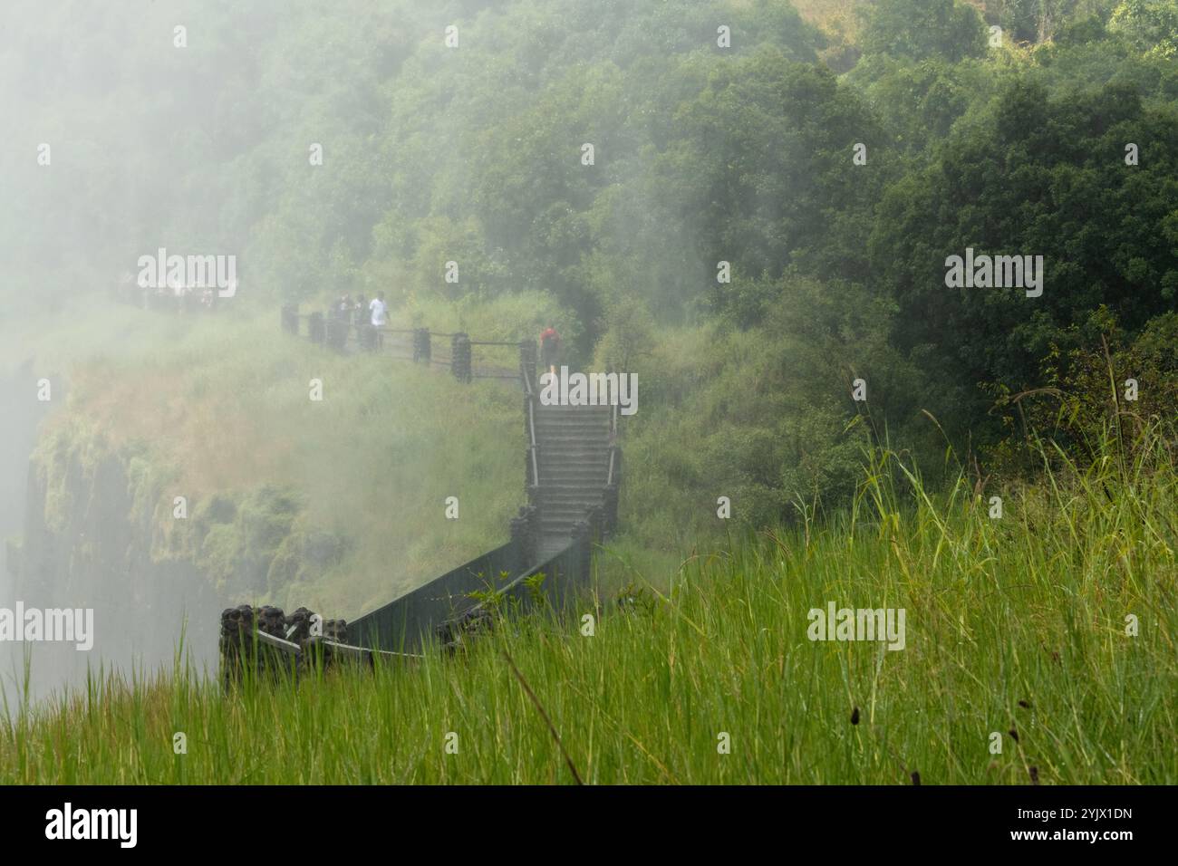 A misty bridge along the edge of the Victoria Falls Stock Photo - Alamy
