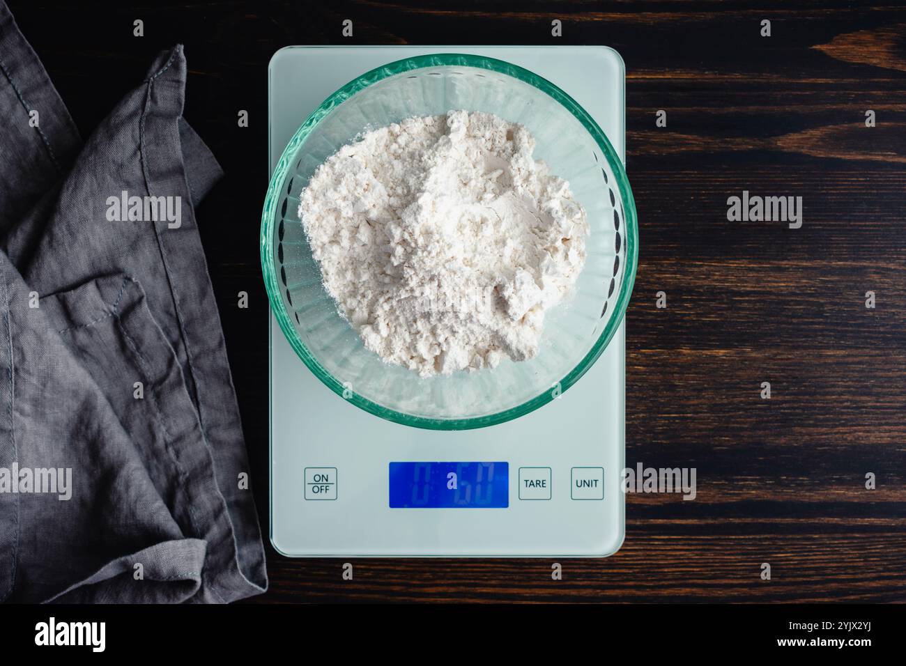 Weighing All-Purpose Flour on a Digital Kitchen Scale: Overhead view of ...