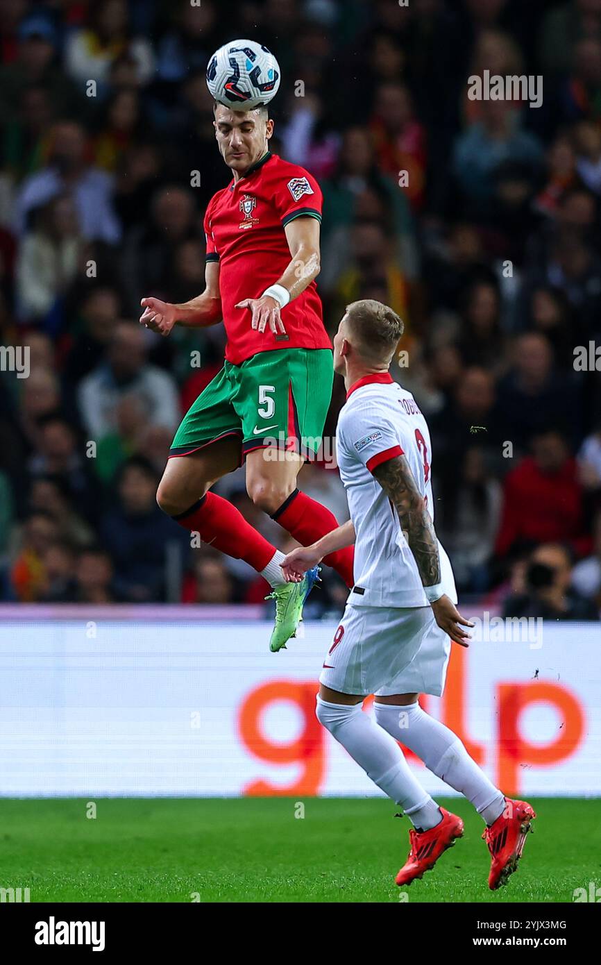 Dragon Stadium, Oporto, Portugal. 15 November, 2024. Pictured left to right, Diogo Dalot, Kamil ...