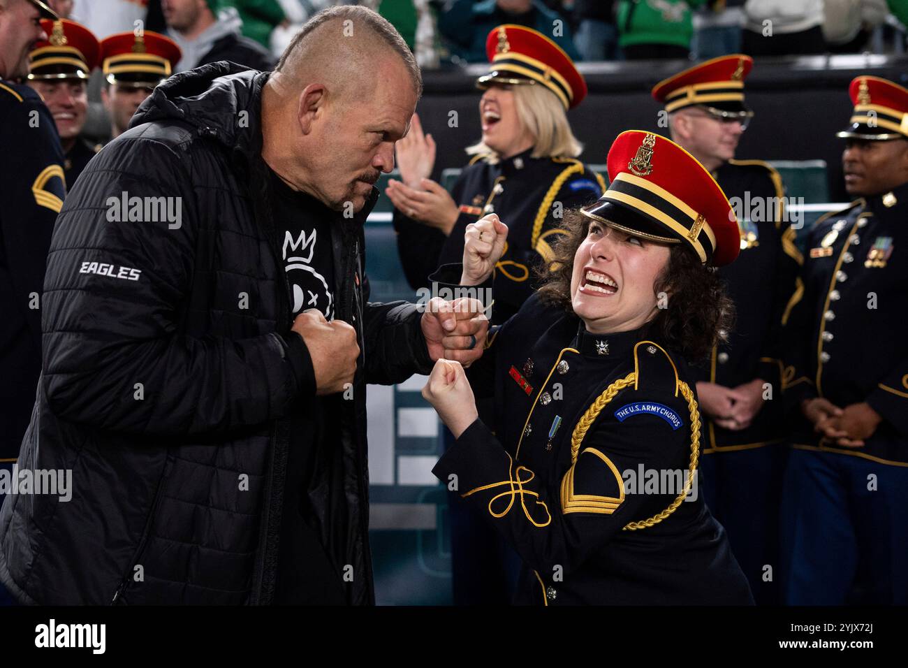 Former MMA fighter Chuck Liddell, left, poses with The U.S. Army Chorus ...