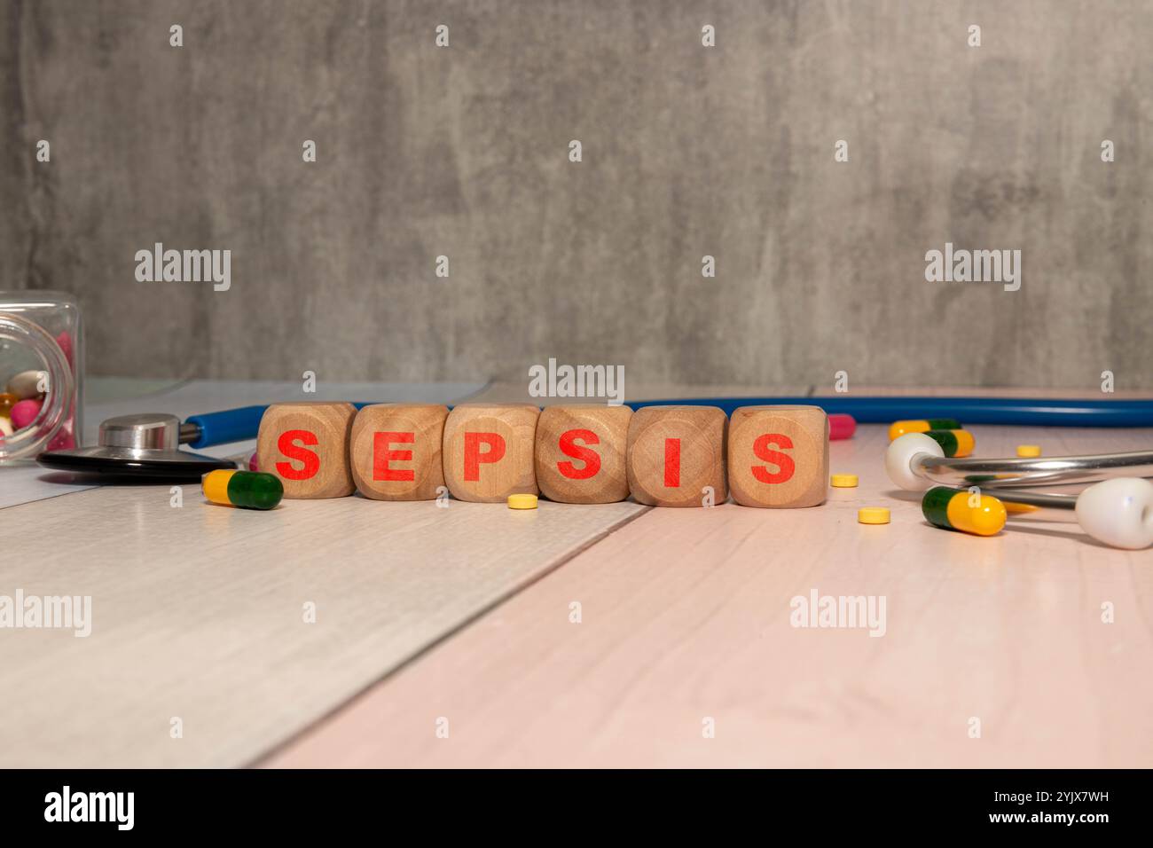top view blocks with word SEPSIS on the white background with pills ...