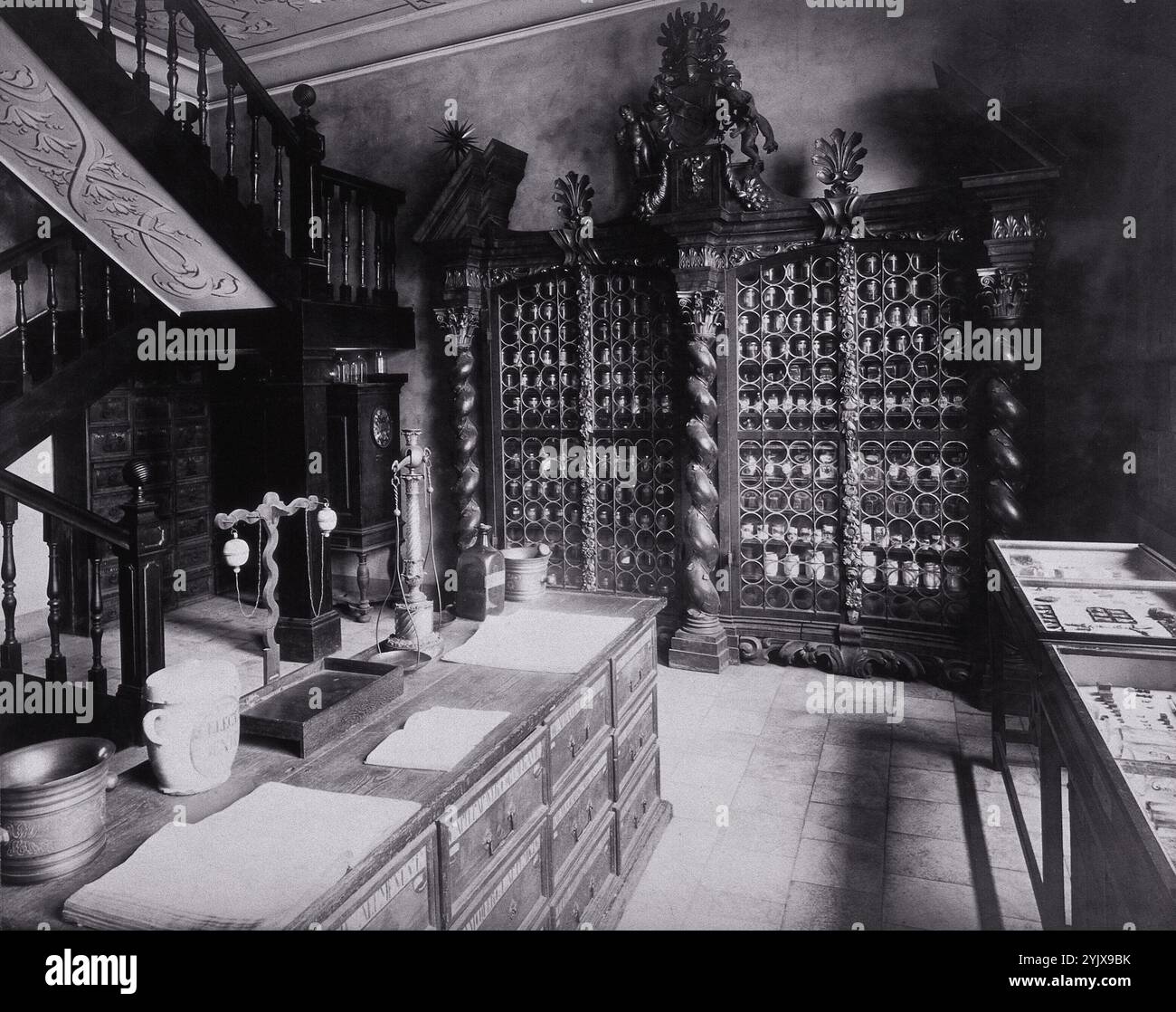 An eighteenth-century apothecary's shop with intricately carved wooden ...